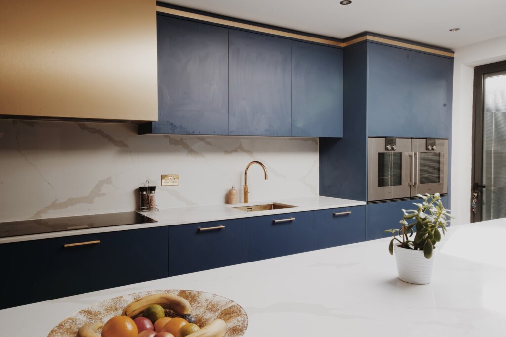 Blue and gold kitchen by The Wood Works - The Kitchen Think