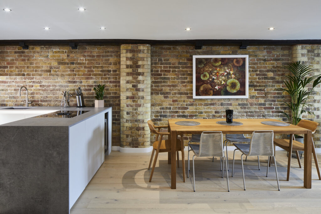 Opening up the kitchen space in an industrial warehouse setting by The ...